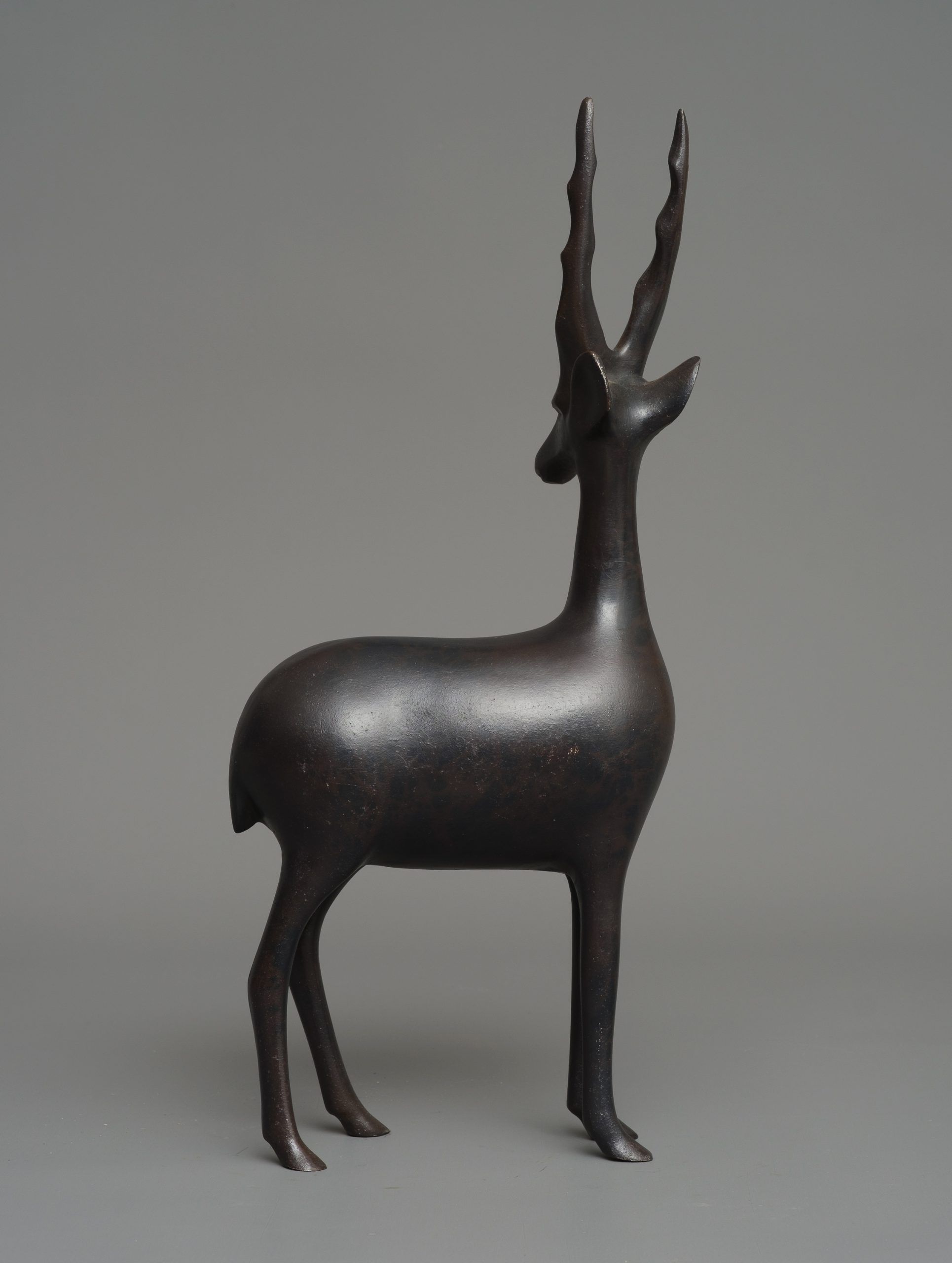 A JAPANESE ART DECO-STYLE ANTILOPE, SHOWA PERIOD (1926-1989)