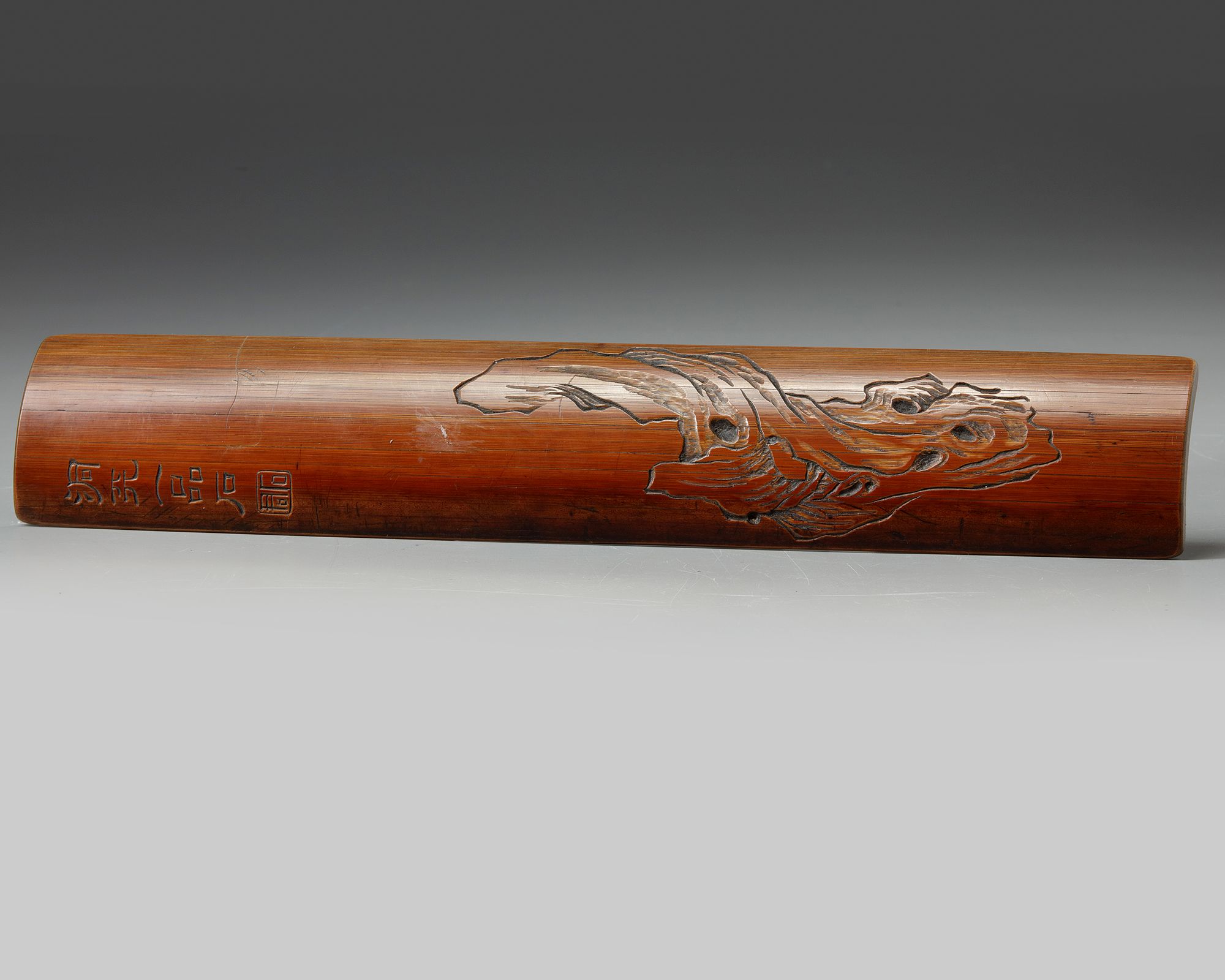 A Chinese wooden wrist rest