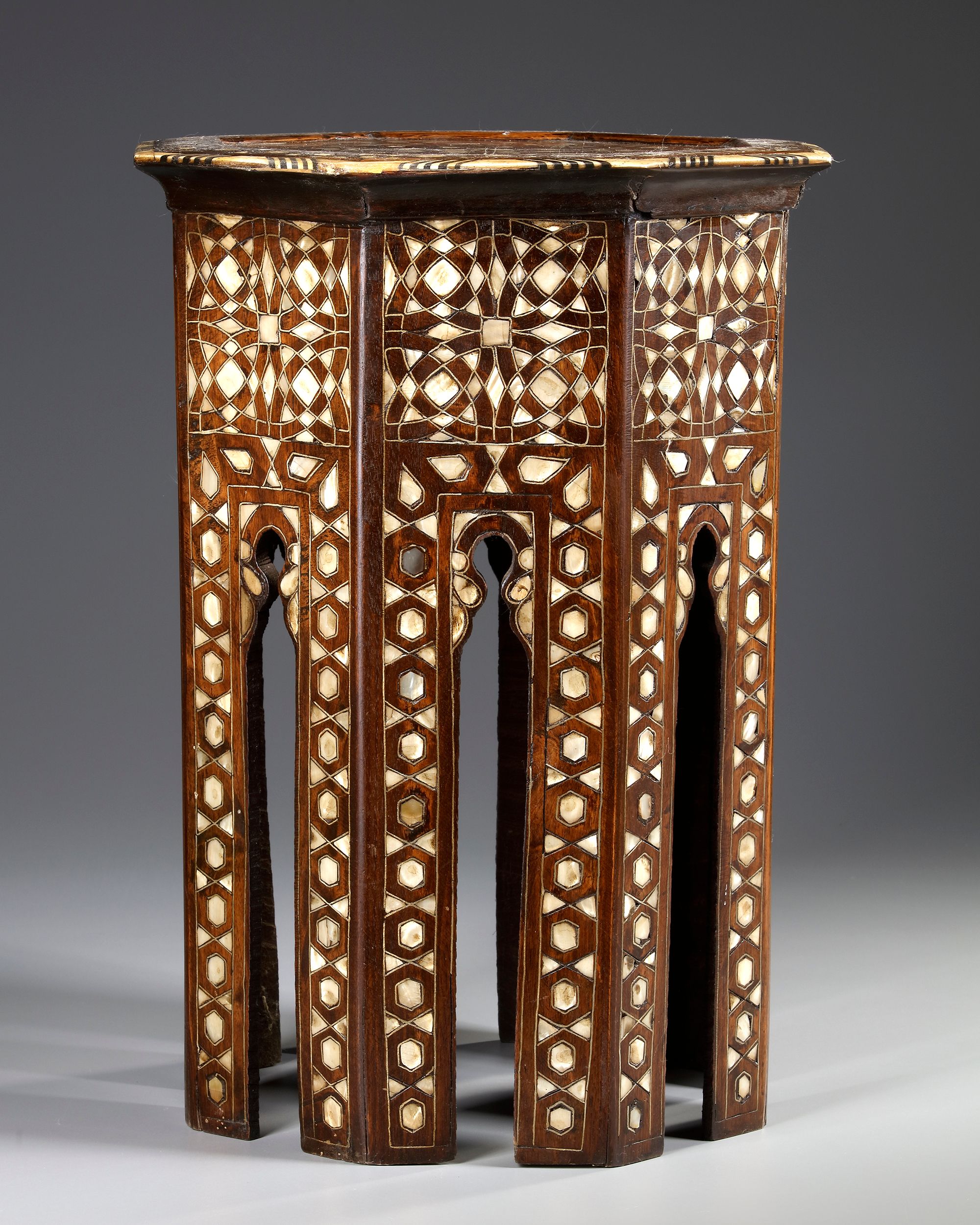 AN OTTOMAN WOOD, BONE AND MOTHER-OF-PEARL INLAID OCTAGONAL TABLE, SYRIA ...